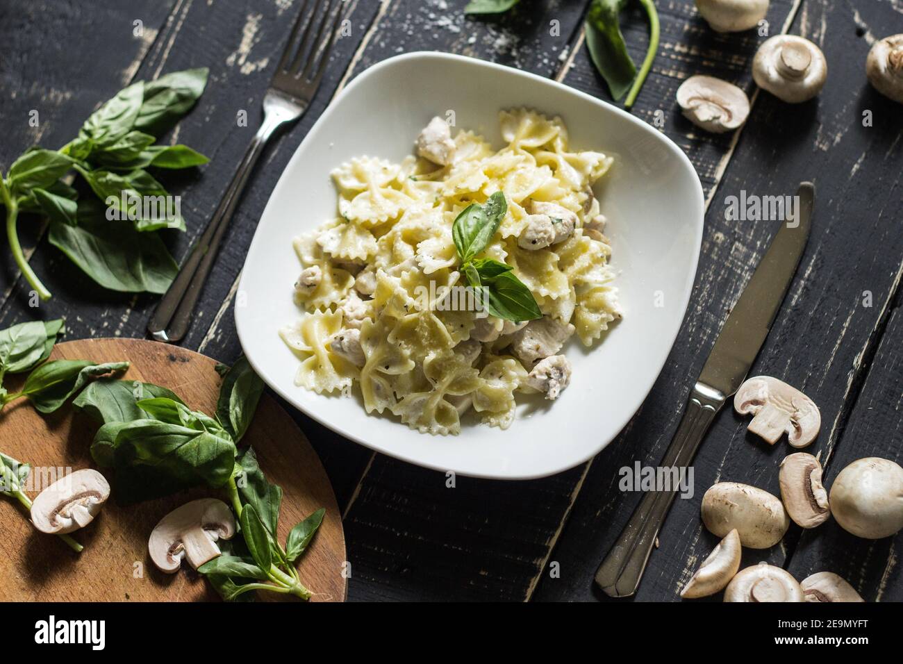Top view of a gourmet pasta dish on a kitchen table with ingredients ...