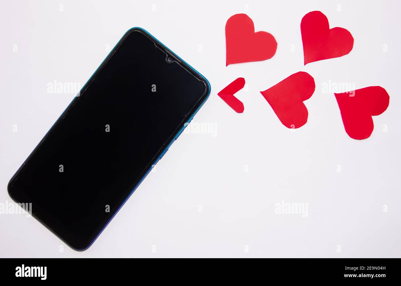 concept social distance Diagonal Mobile phone with red hearts coming ...