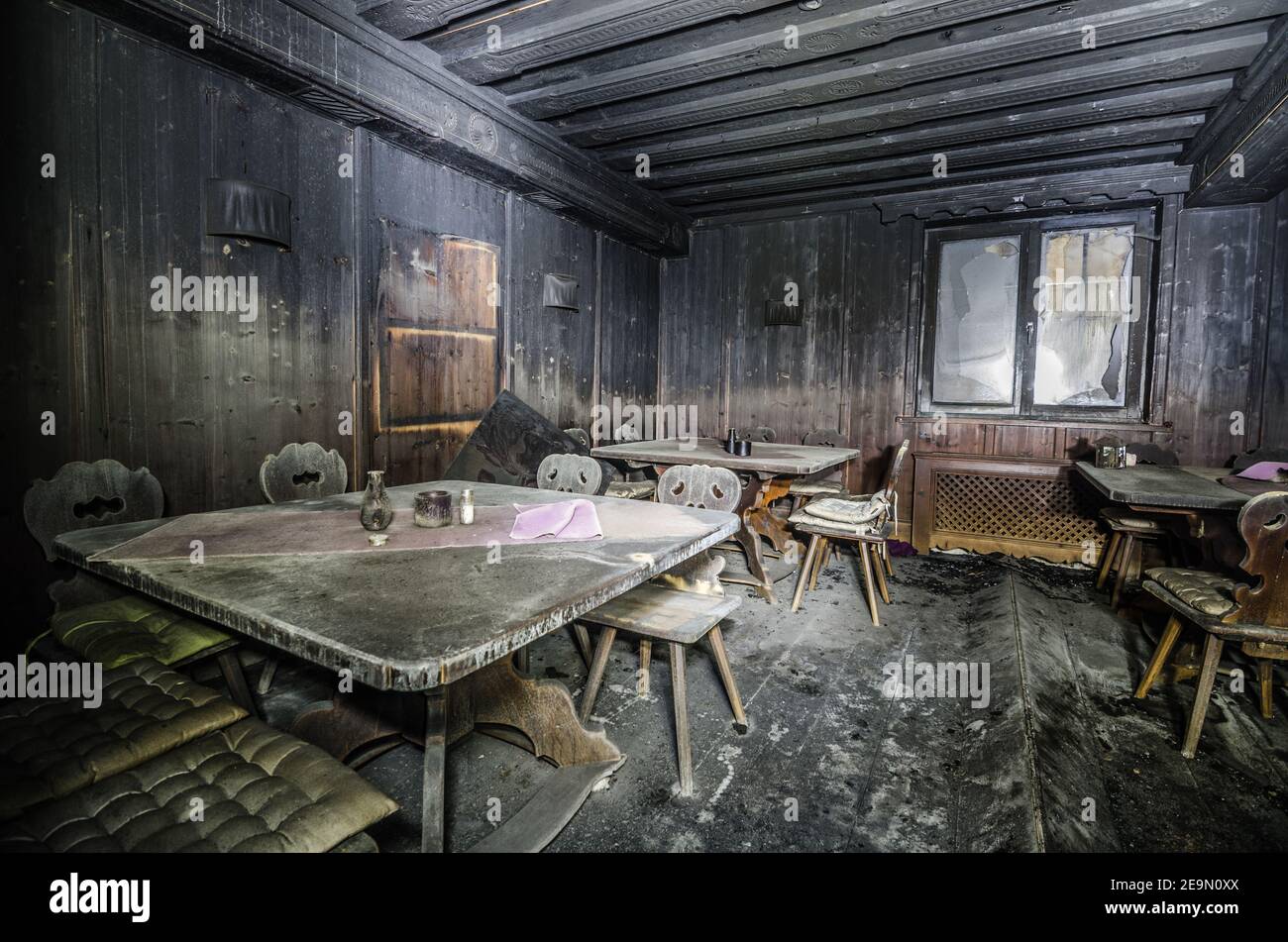 burned furniture in a guest house after big fire Stock Photo - Alamy