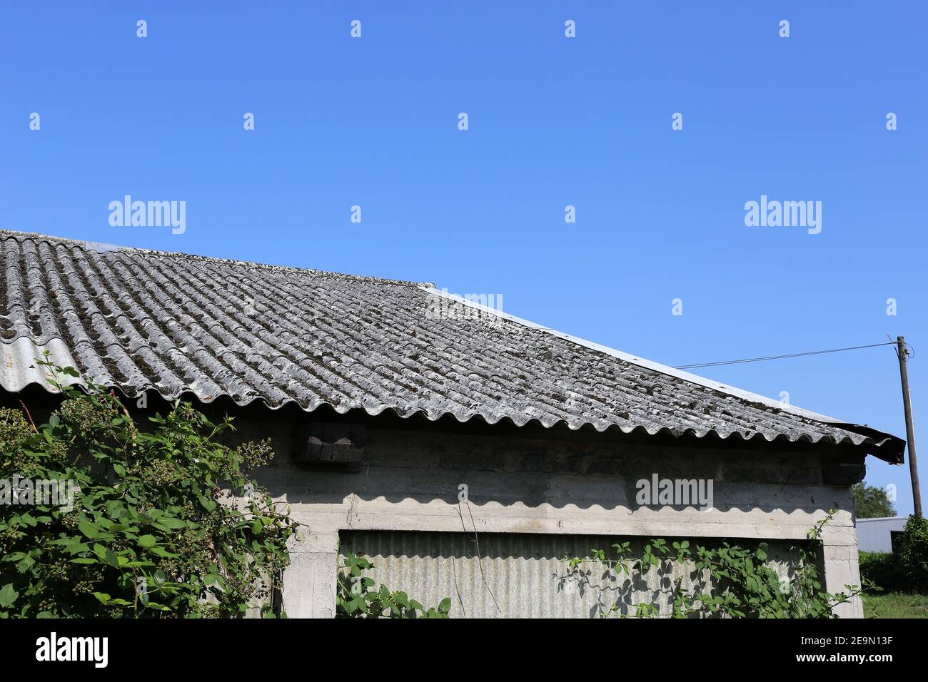 Asbestos roof on an old commercial or industrial building Stock Photo ...