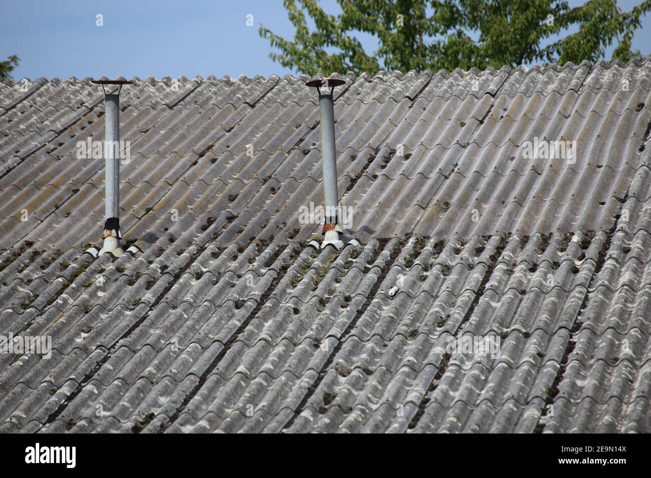 Asbestos roof on an old commercial or industrial building Stock Photo ...
