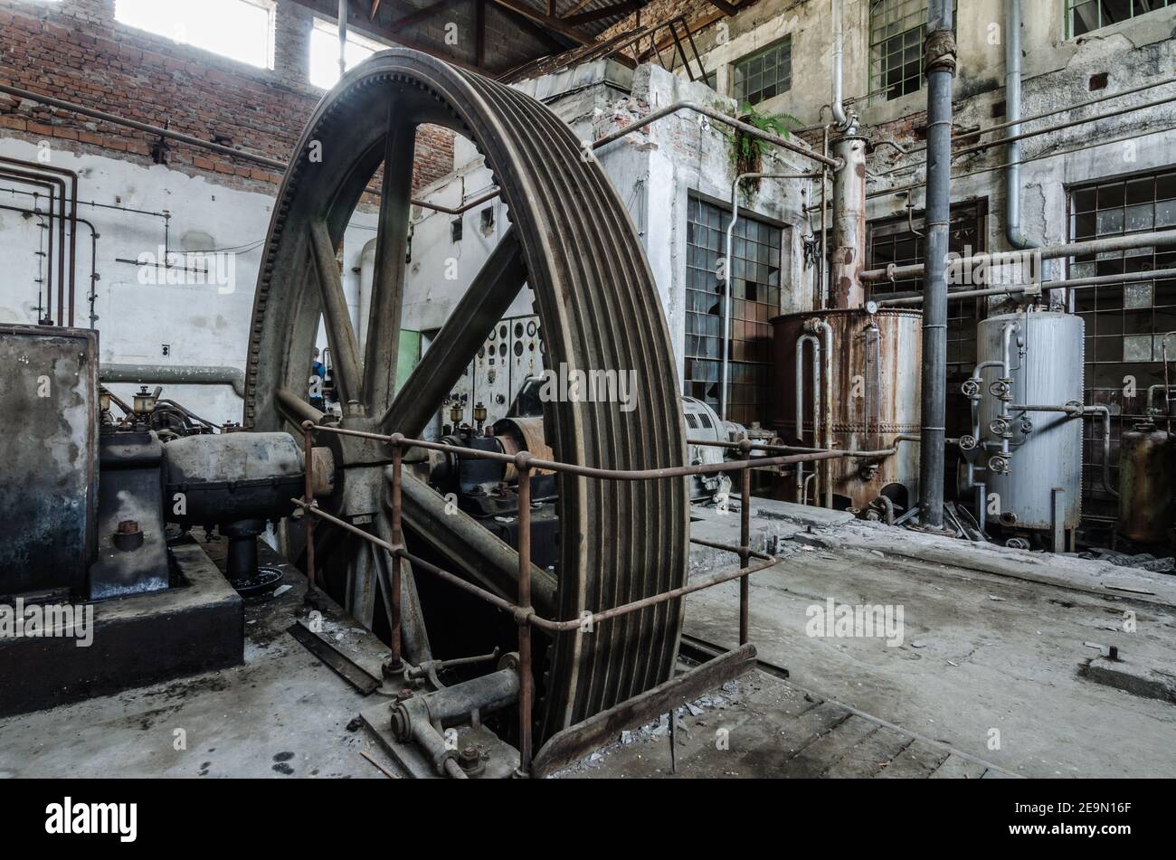 large old drive wheel in a factory Stock Photo - Alamy