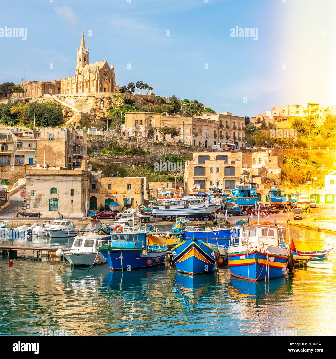 Port of the island of Gozo with its fishing boats, in Malta in the far ...