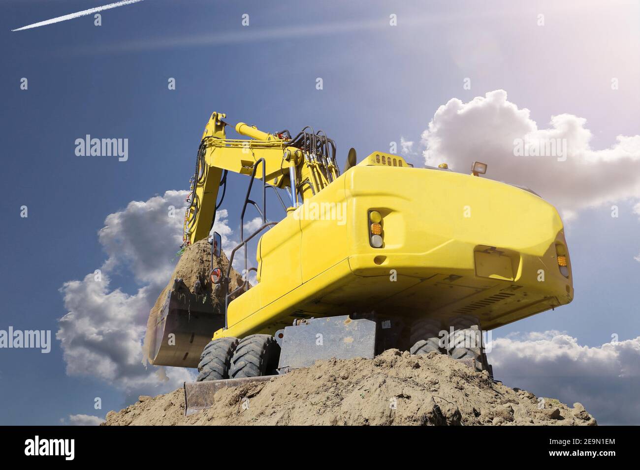 Excavation work with excavator on a building site Stock Photo - Alamy