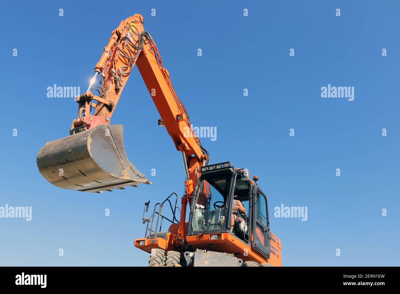 Excavation work with excavator on a building site Stock Photo - Alamy