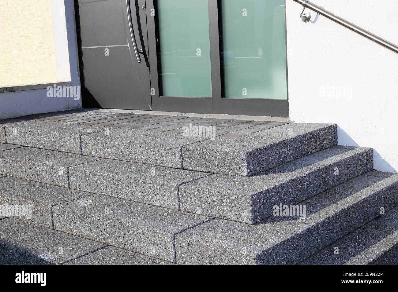 Modern block staircase in the front garden of a residential building ...