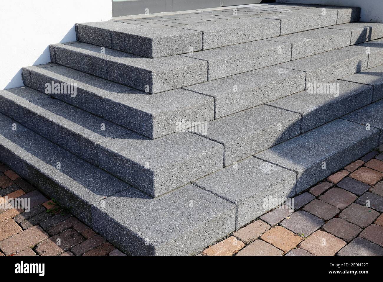 Modern block staircase in the front garden of a residential building ...