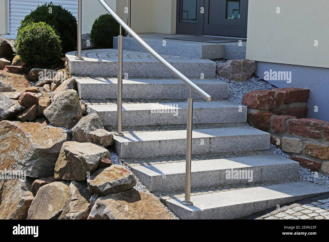 Modern block staircase in the front garden of a residential building ...
