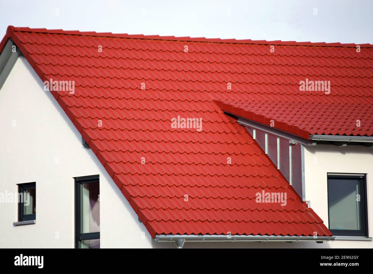 New tile roof on a residential house Stock Photo - Alamy