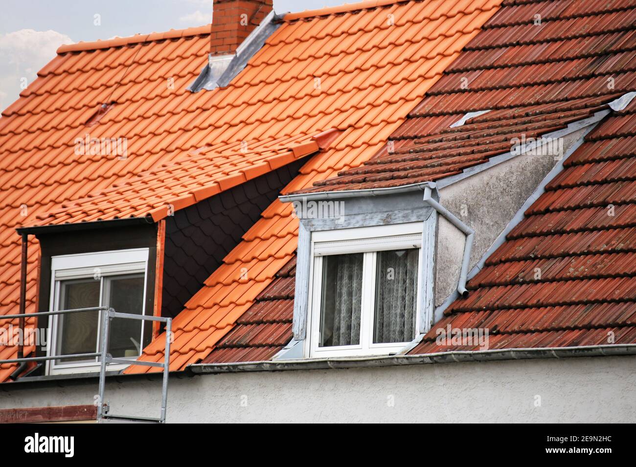 Semi-detached house with old roof and with renovated roof Stock Photo ...