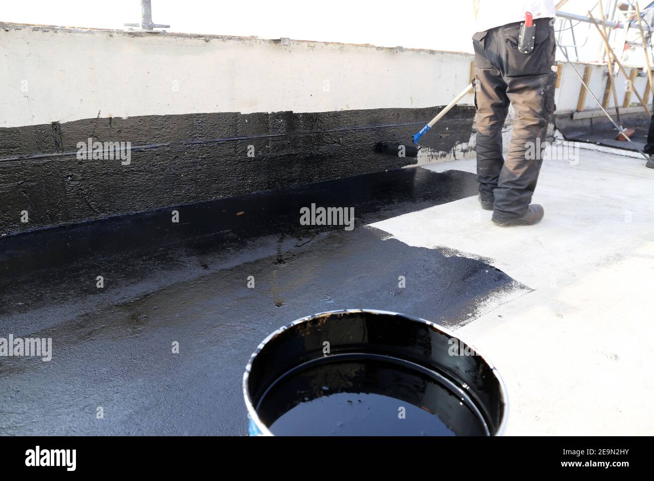 Bitumen primer for flat roof waterproofing Stock Photo - Alamy