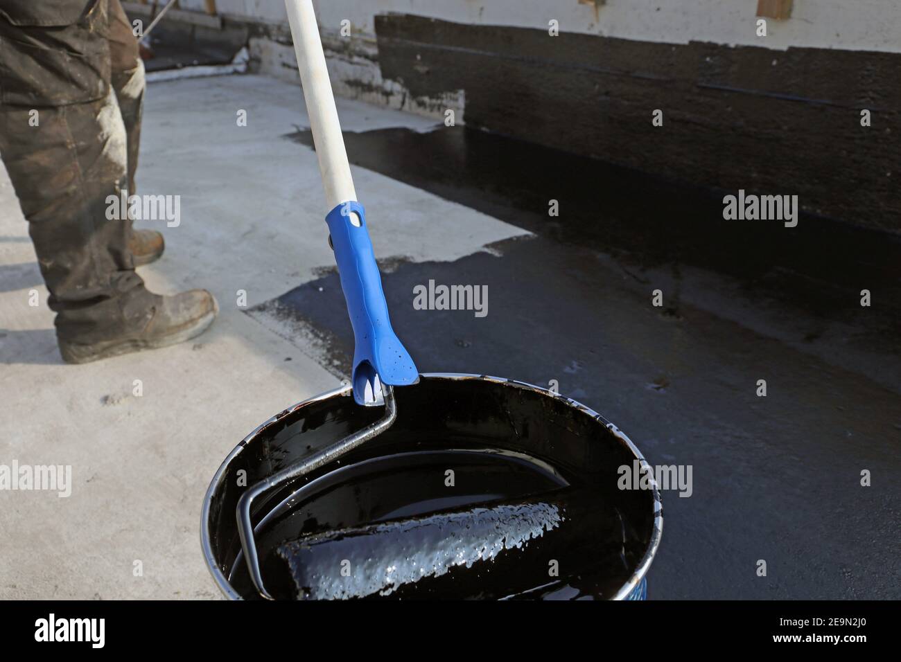 Bitumen primer for flat roof waterproofing Stock Photo - Alamy