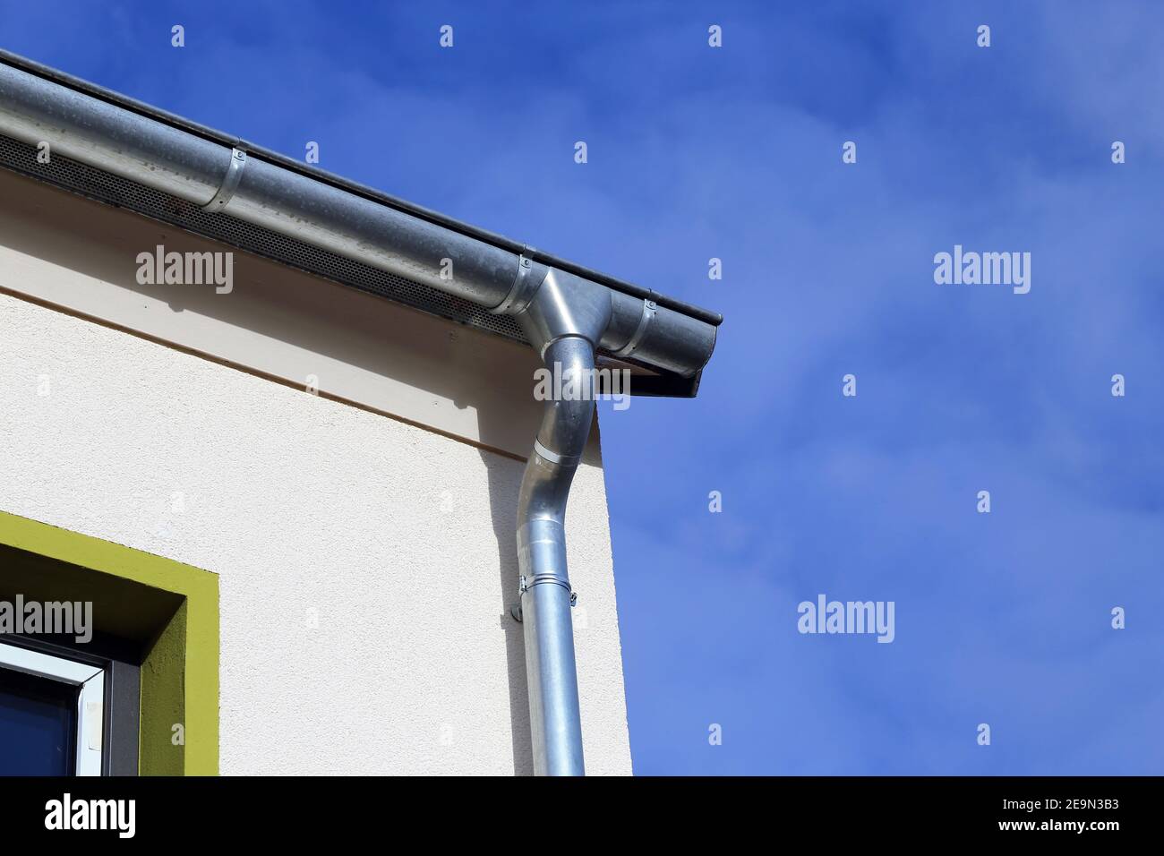 Roof gutter on a new tiled roof Stock Photo - Alamy