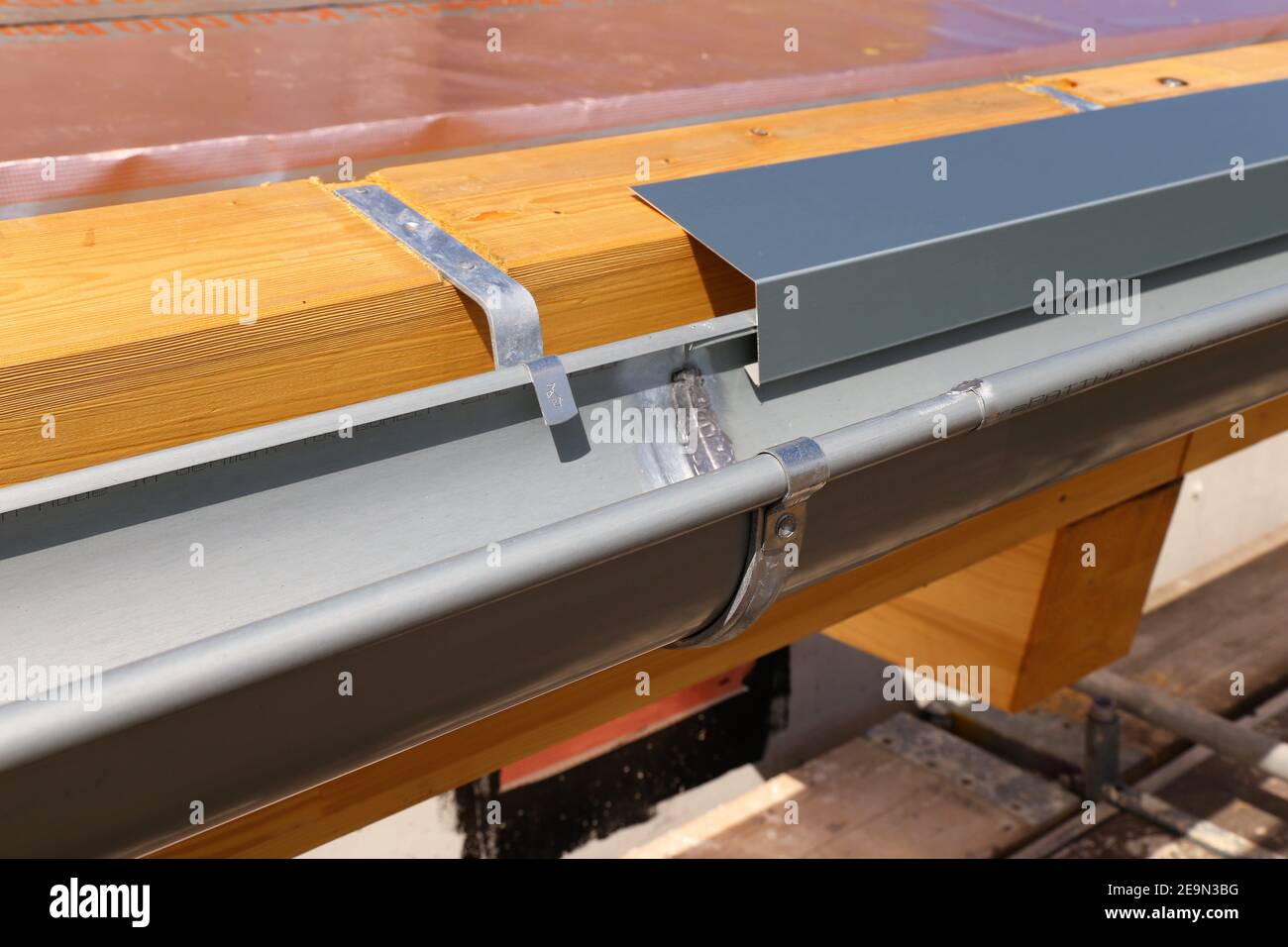 Roof gutter on a new tiled roof Stock Photo - Alamy