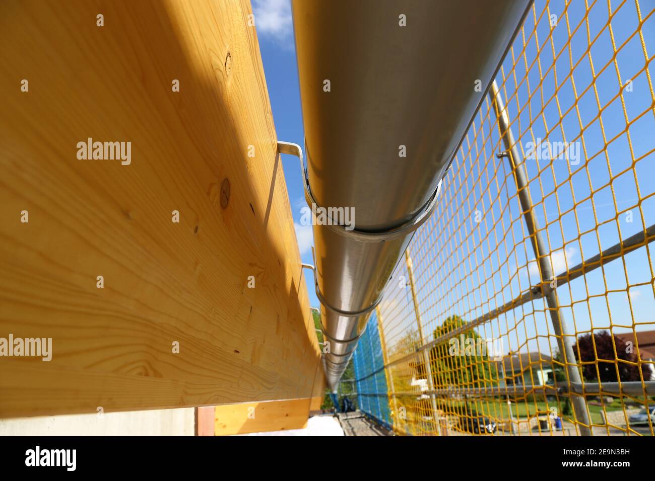 Roof gutter on a new tiled roof Stock Photo - Alamy