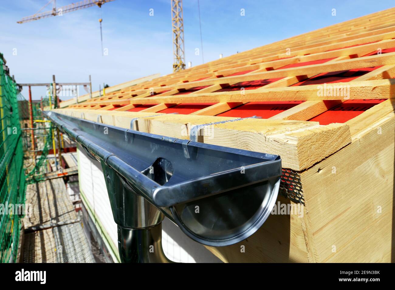 Roof gutter on a new tiled roof Stock Photo - Alamy