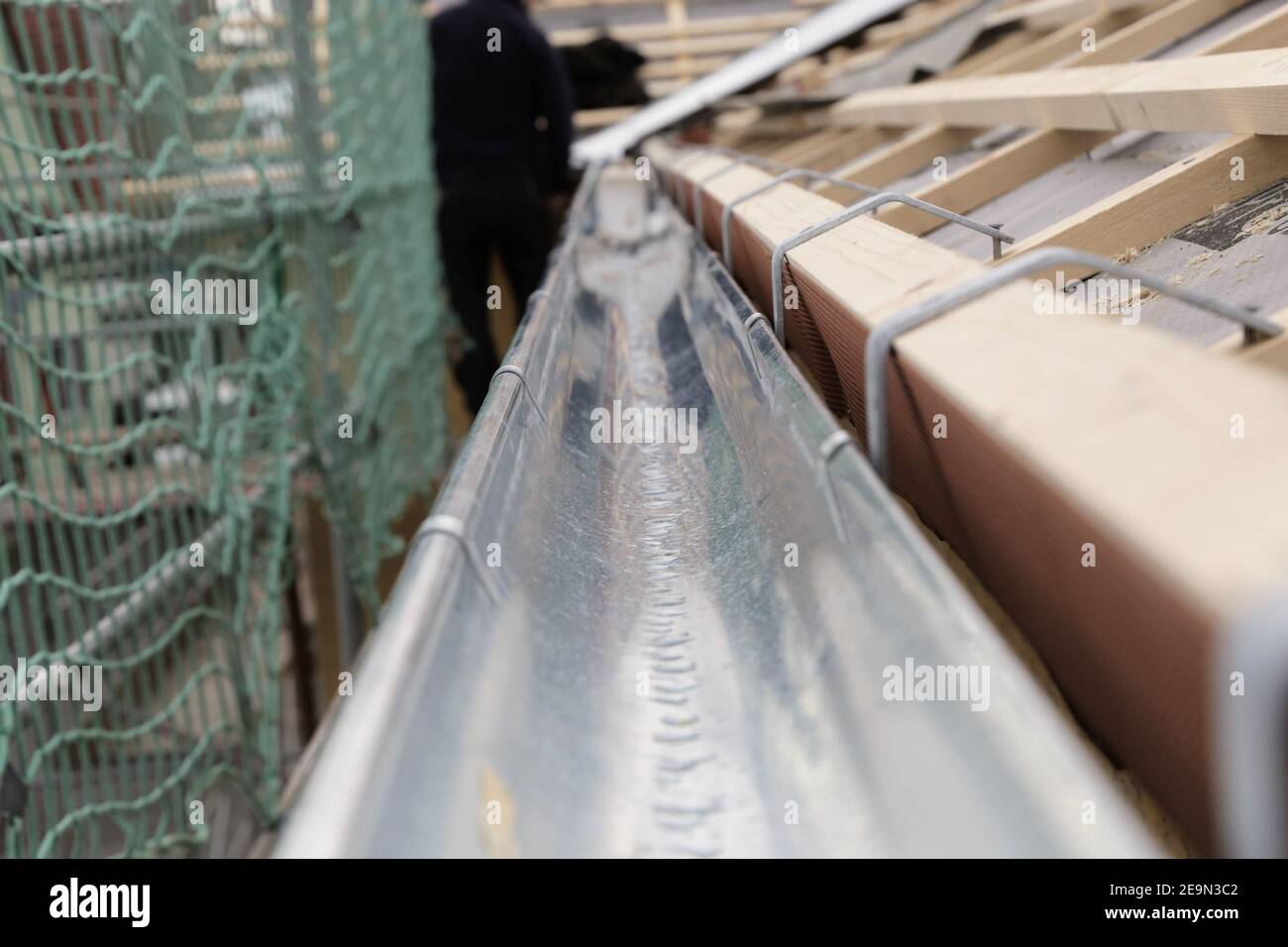 Roof gutter on a new tiled roof Stock Photo - Alamy