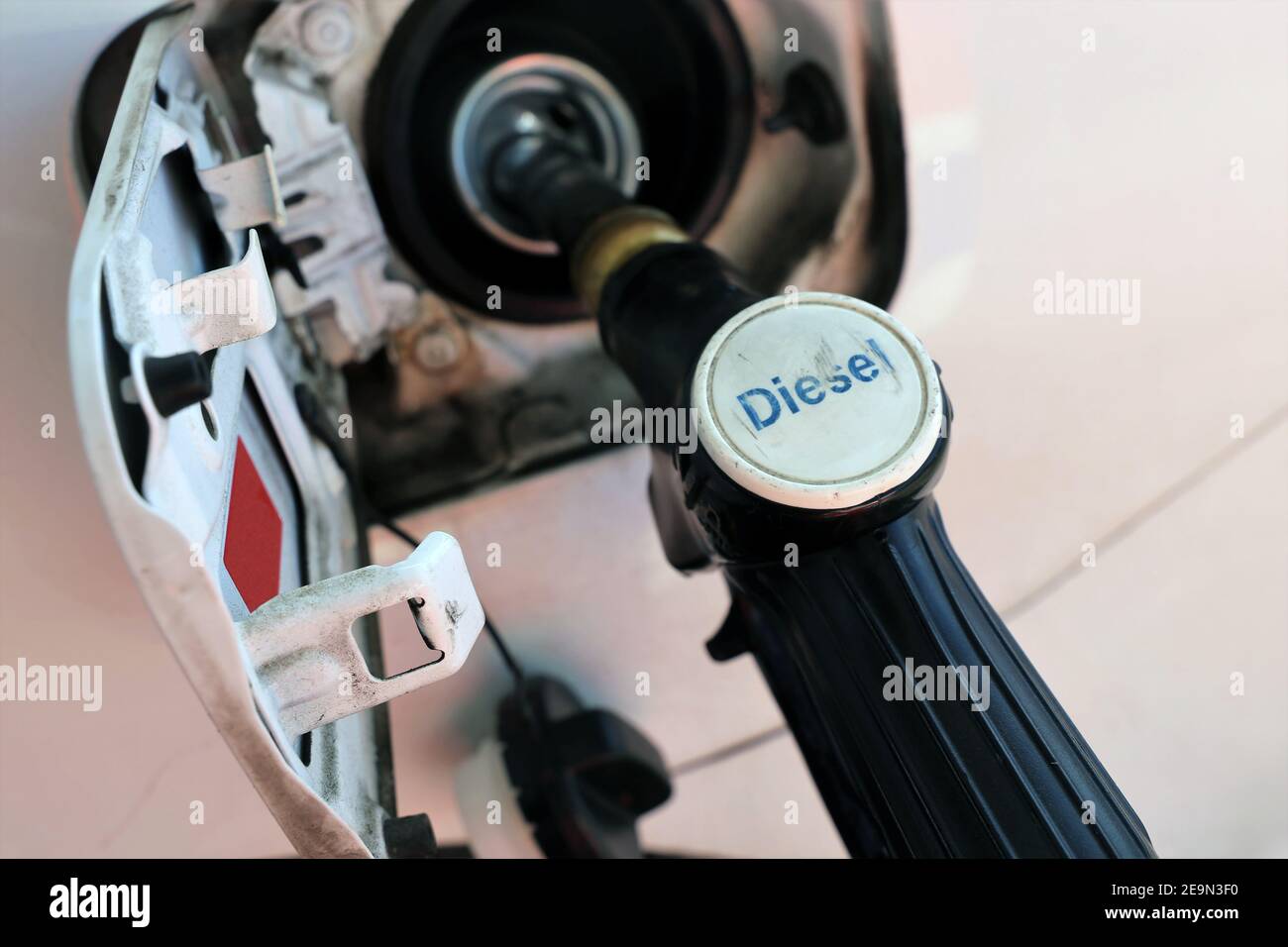 Close-up of a fuel nozzle during refueling of a passenger car Stock ...