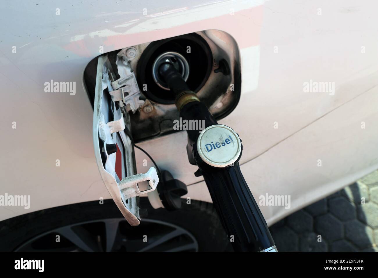 Close-up of a fuel nozzle during refueling of a passenger car Stock ...