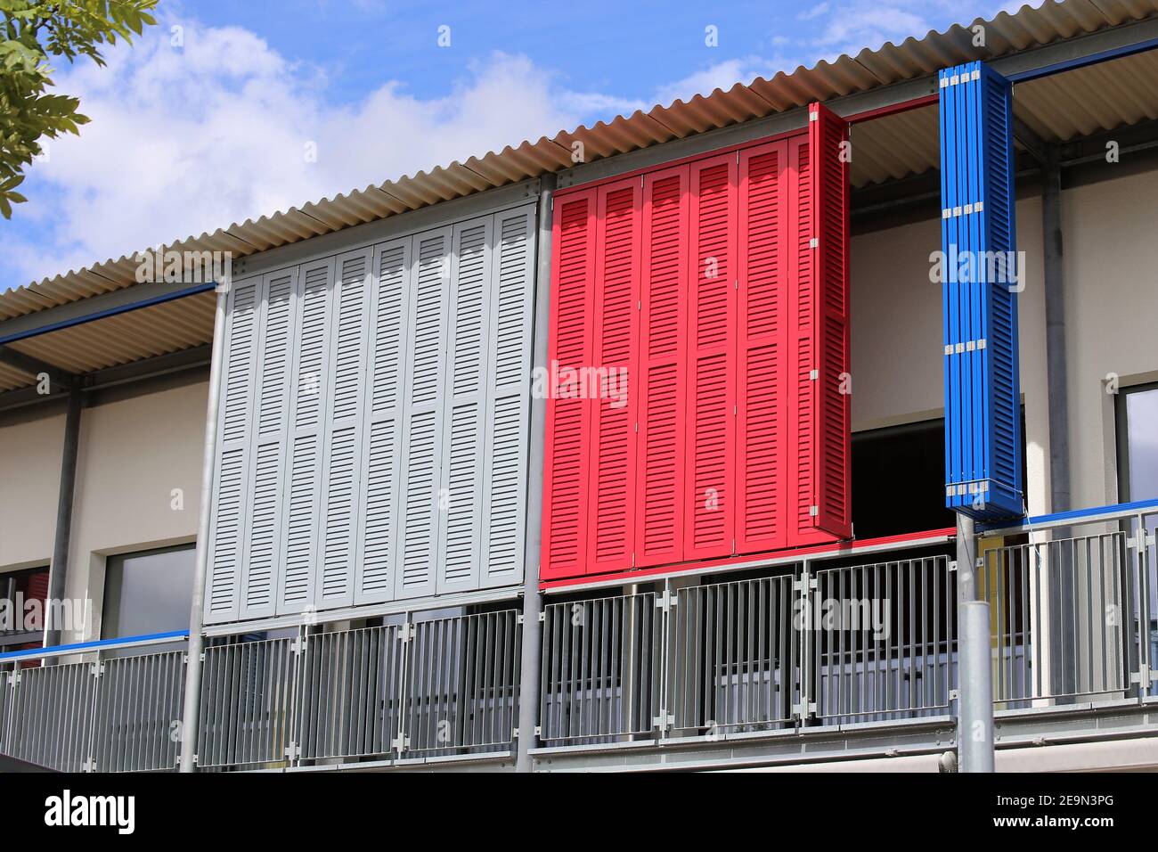 Large modern folding sliding shutters on a building Stock Photo - Alamy