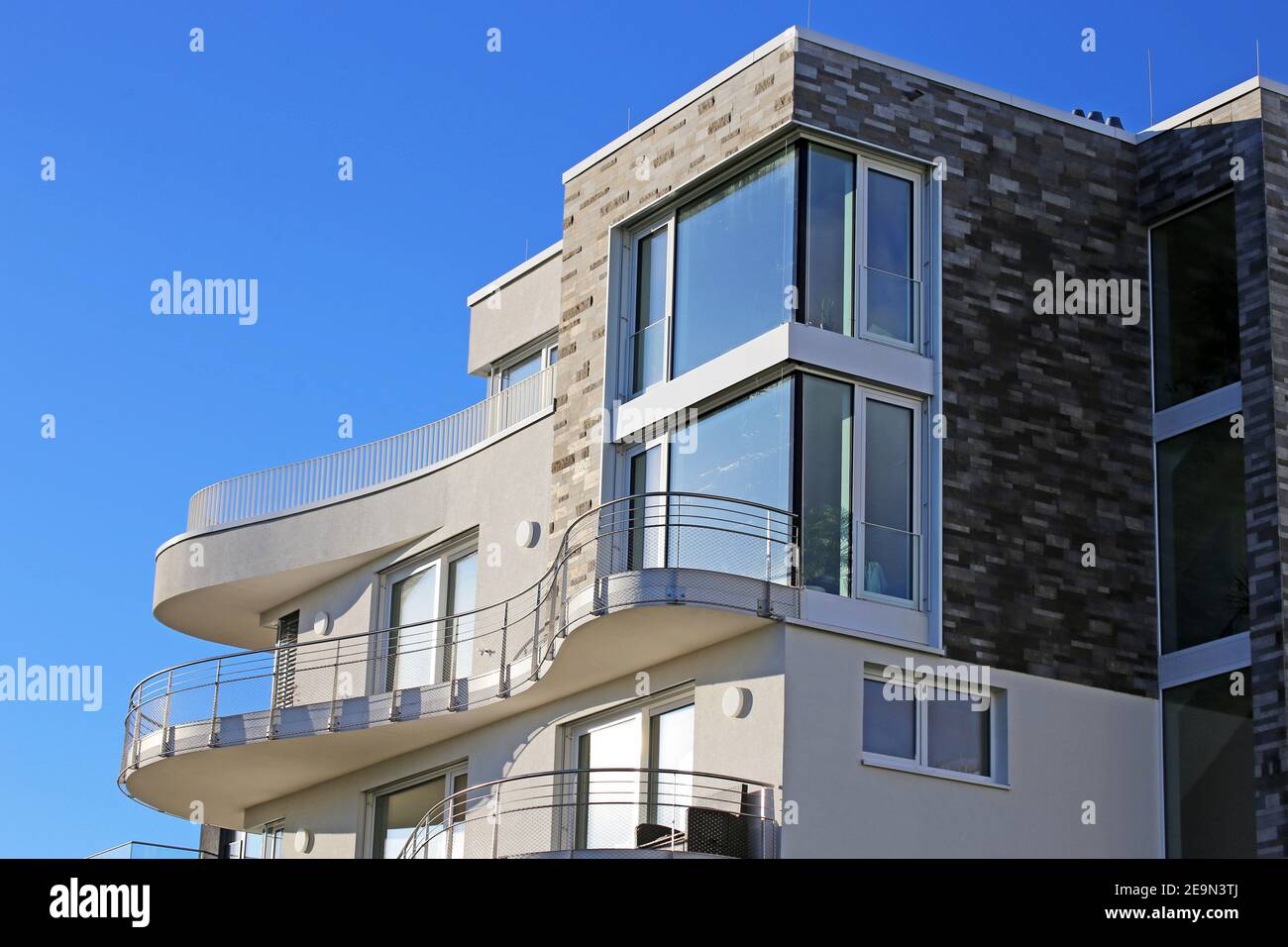 Modern apartment building in urban style Stock Photo - Alamy