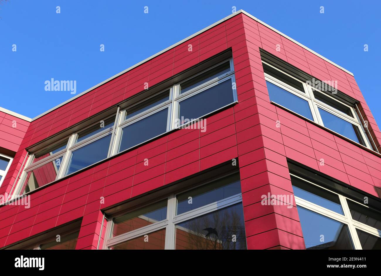 Modern building with facade cladding Stock Photo - Alamy