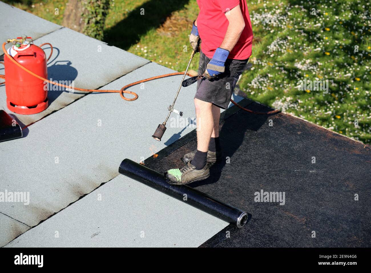 Professional flat roof waterproofing with bitumen welded sheeting Stock Photo - Alamy