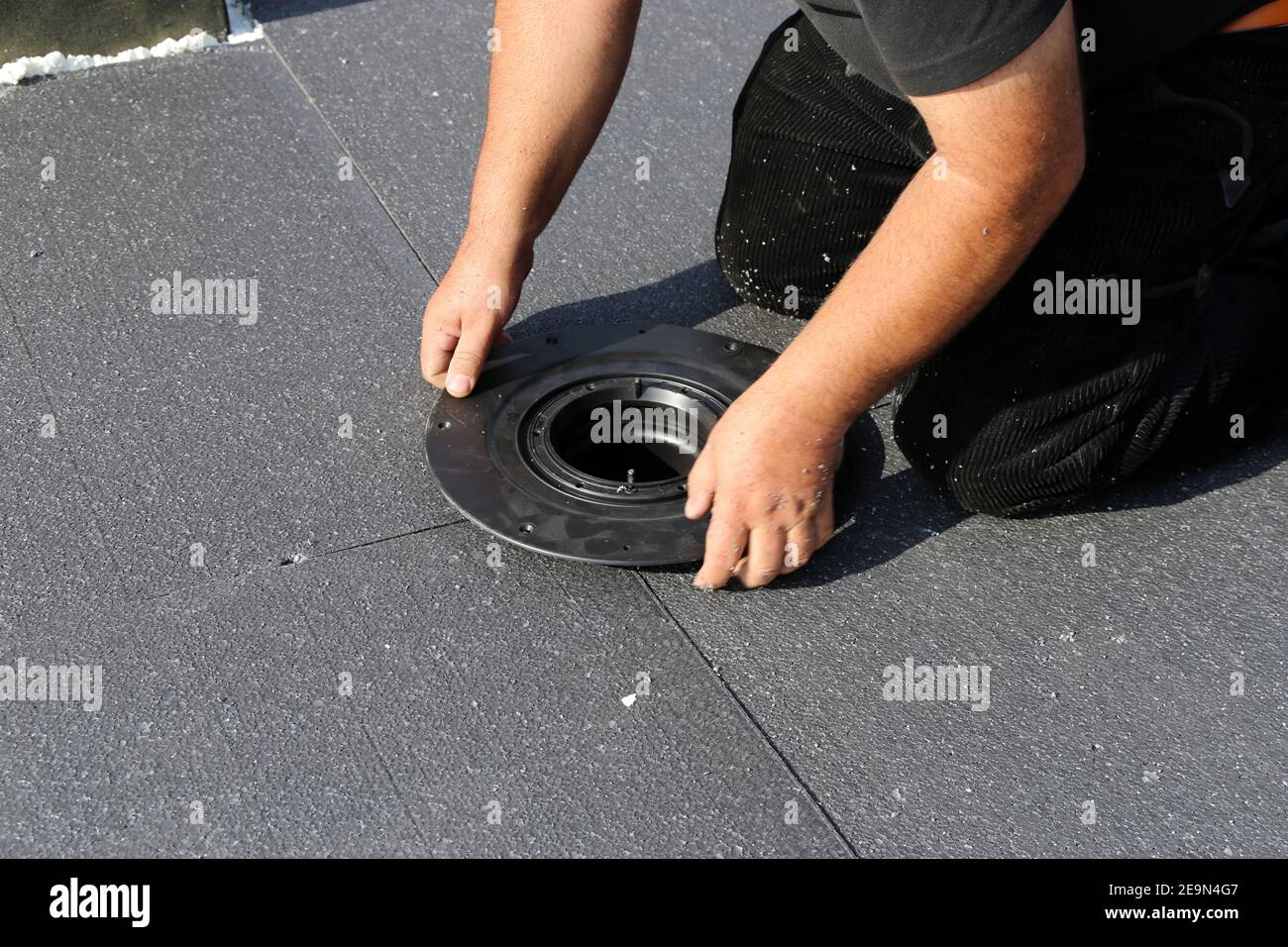 Installation of gradient insulation on a flat roof Stock Photo - Alamy