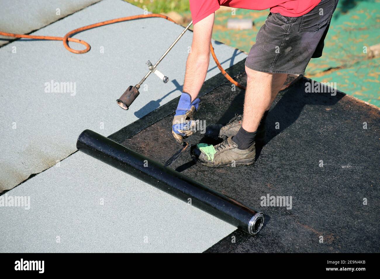 Professional flat roof waterproofing with bitumen welded sheeting Stock Photo - Alamy