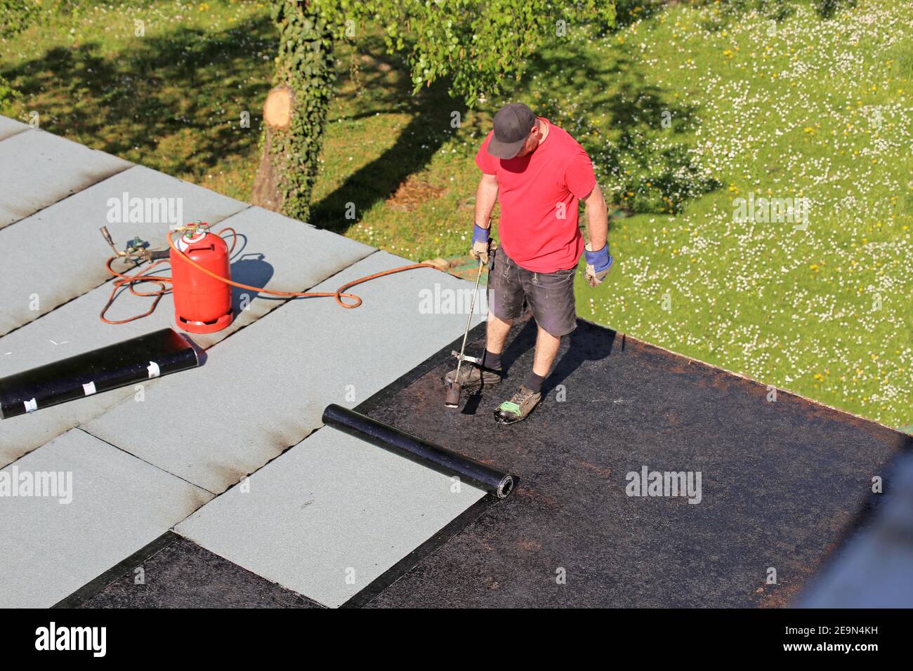 Professional flat roof waterproofing with bitumen welded sheeting Stock ...