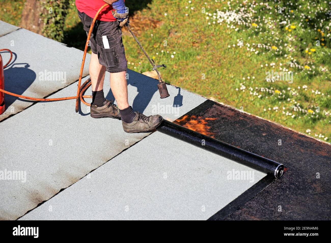 Professional flat roof waterproofing with bitumen welded sheeting Stock Photo - Alamy
