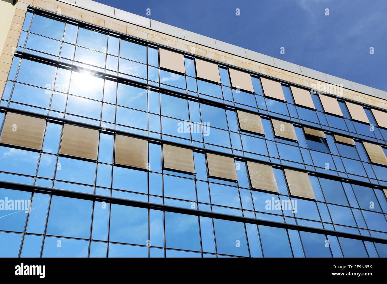 Building with large and modern glass facade Stock Photo - Alamy