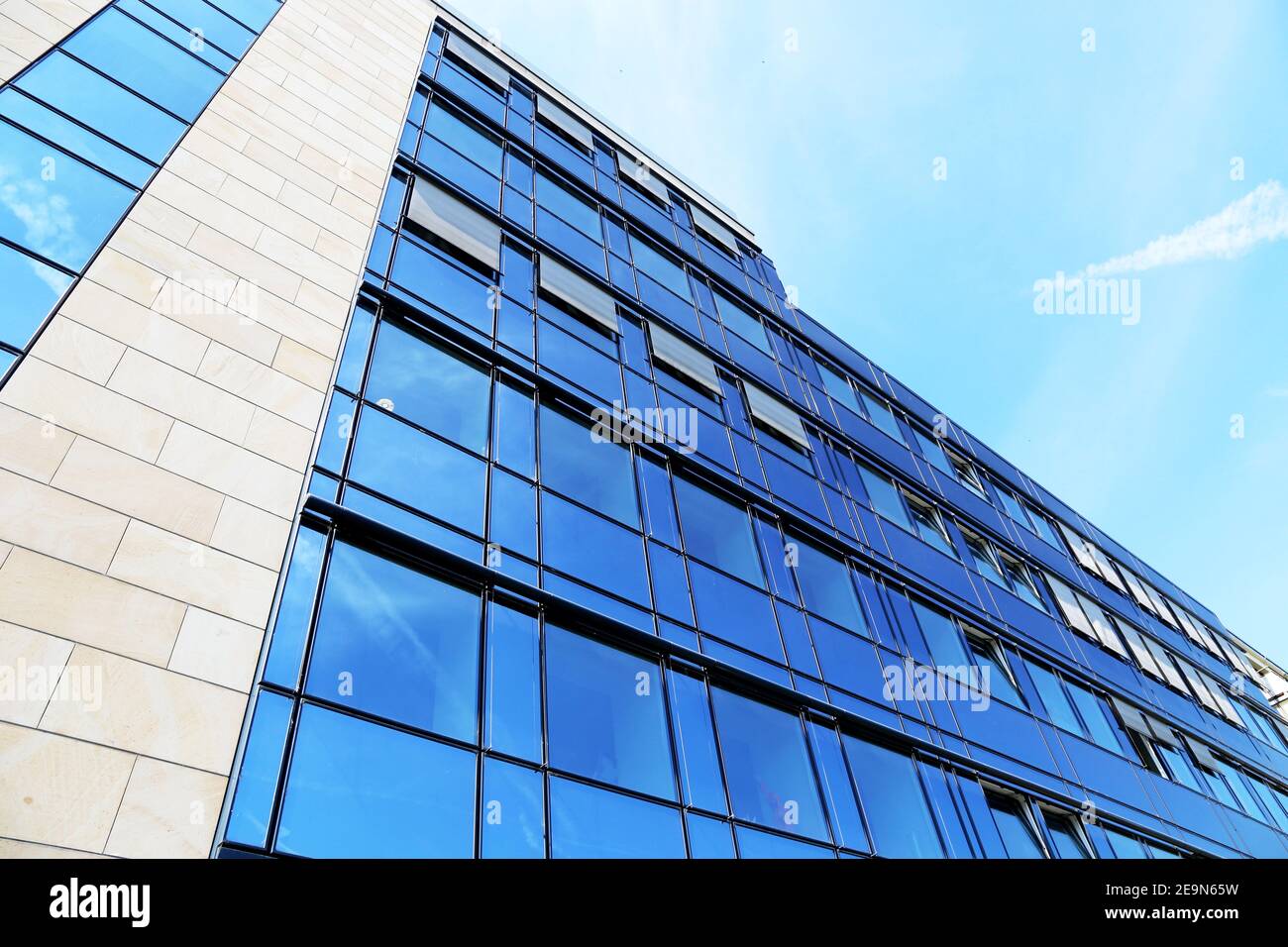 Building with large and modern glass facade Stock Photo - Alamy