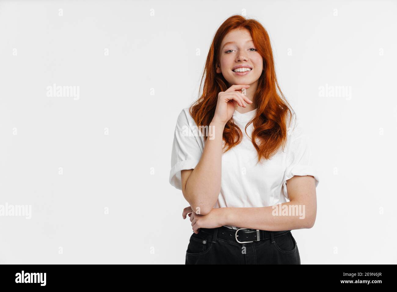 Ginger beautiful happy girl posing and smiling at camera isolated over ...