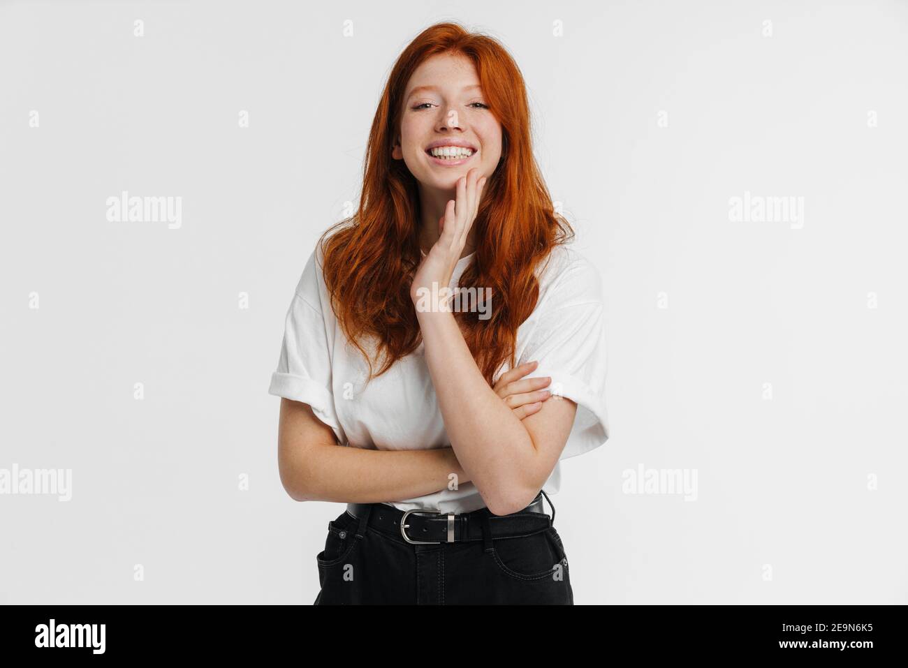 Ginger beautiful happy girl posing and smiling at camera isolated over ...