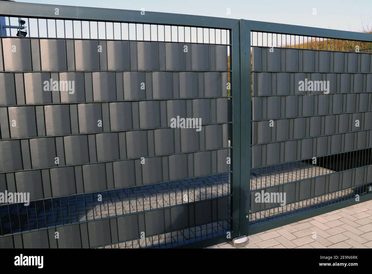 Modern steel yard gate with privacy protection Stock Photo - Alamy