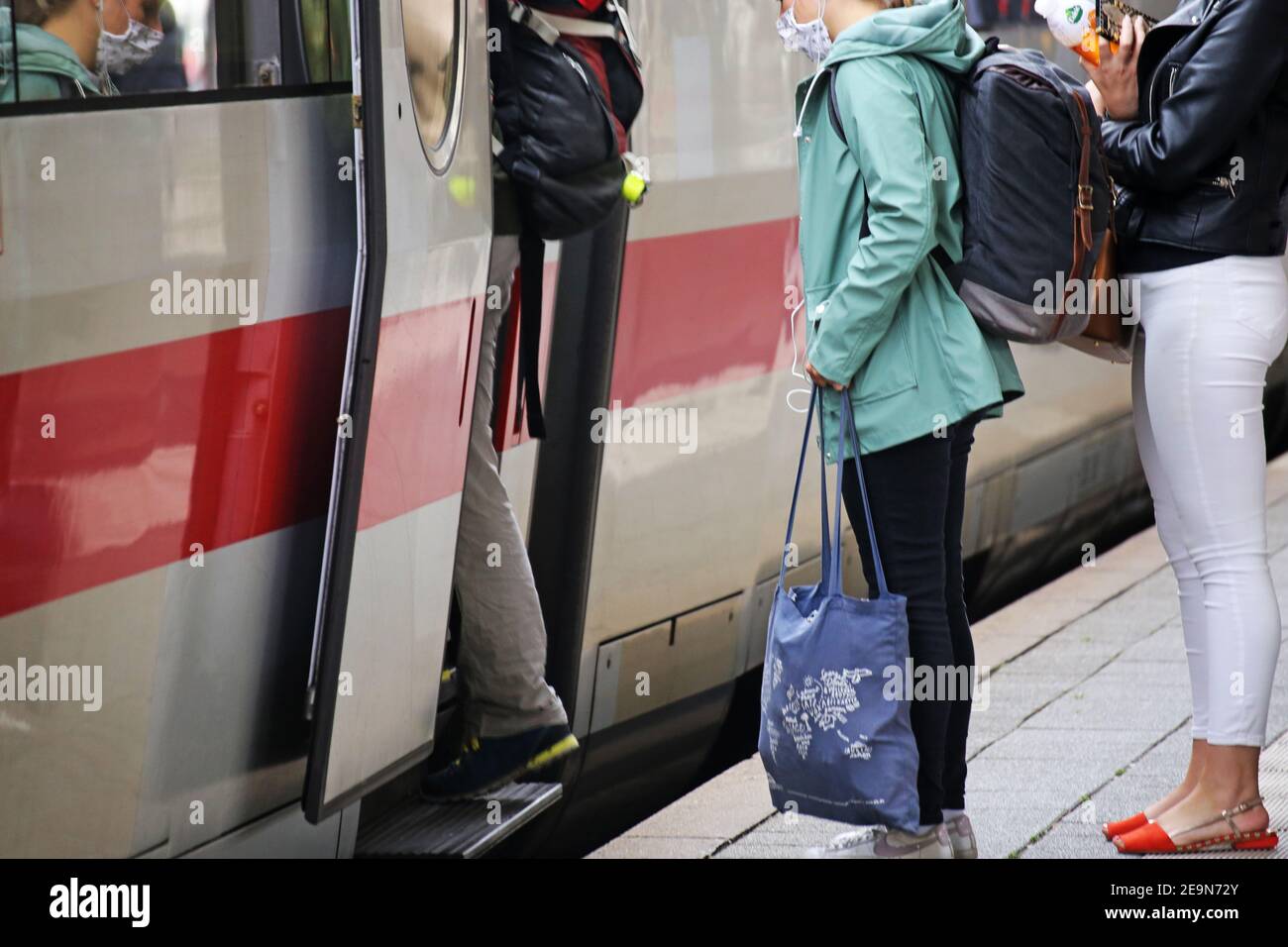 Woman getting off train railway hi-res stock photography and images - Alamy