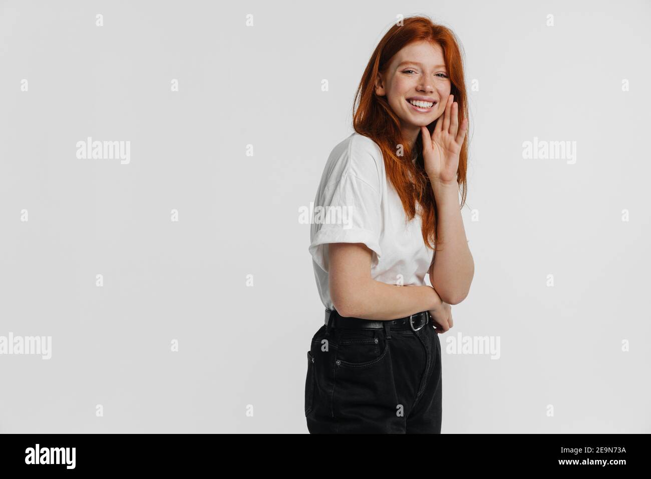 Ginger beautiful happy girl posing and smiling at camera isolated over ...