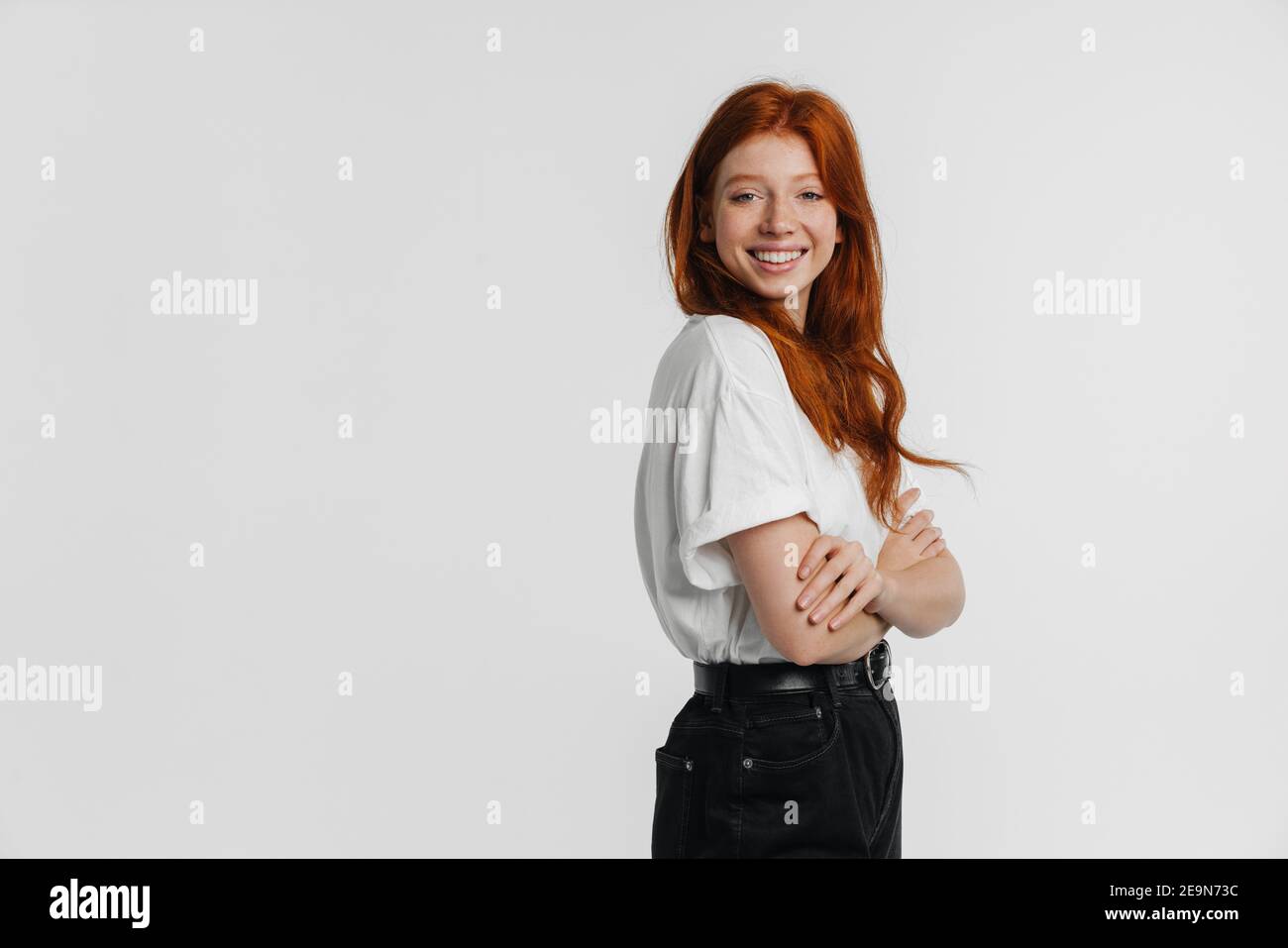 Ginger beautiful happy girl posing and smiling at camera isolated over ...
