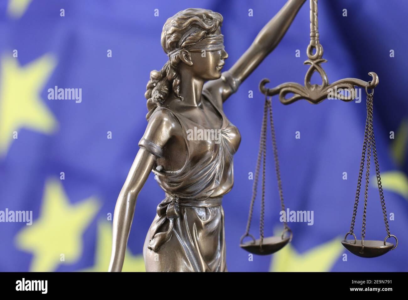 Symbol image: Justitia in front of a Europe flag Stock Photo - Alamy