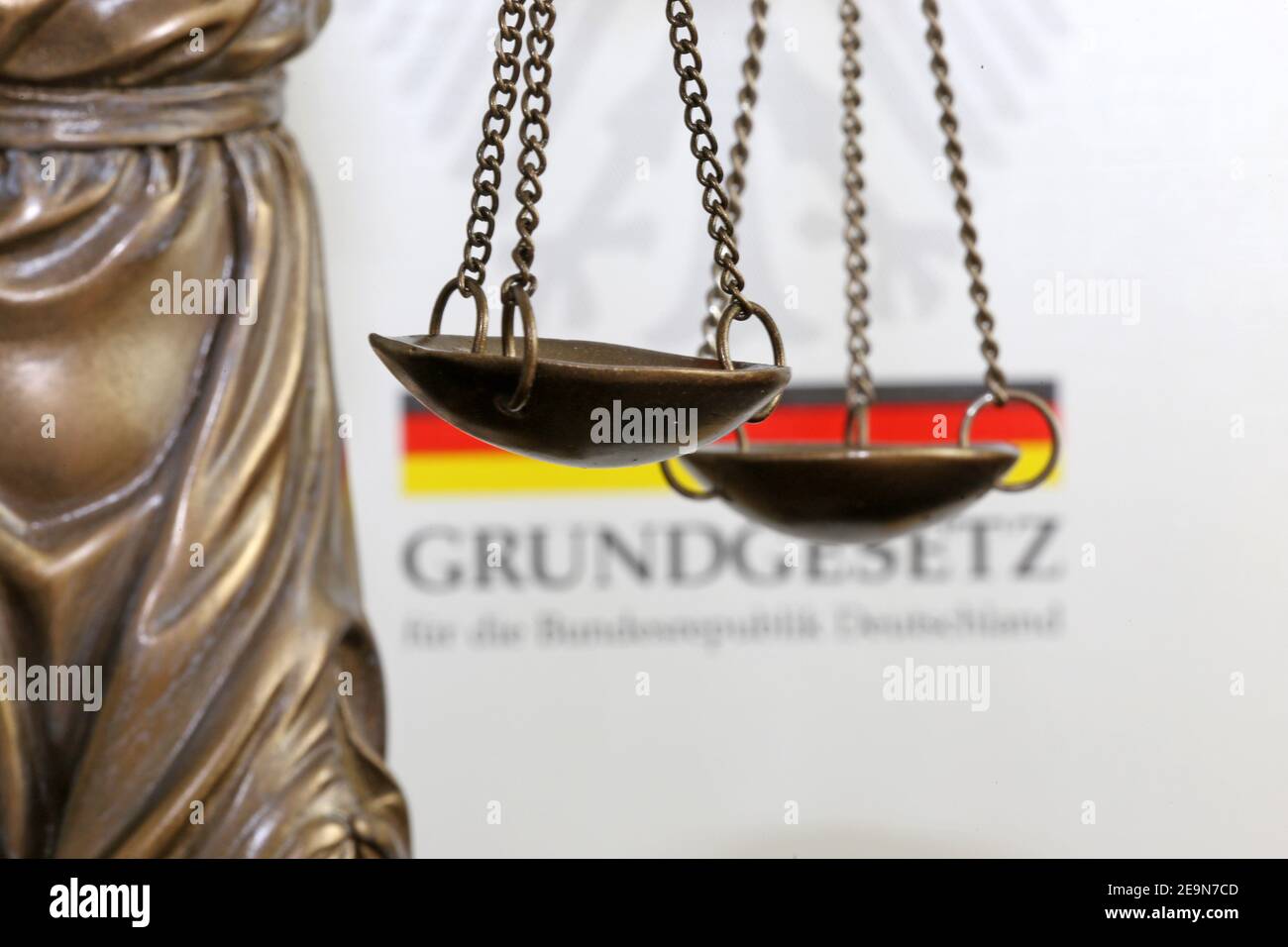 Close-up of a Justitia in front of a german basic law book Stock Photo ...