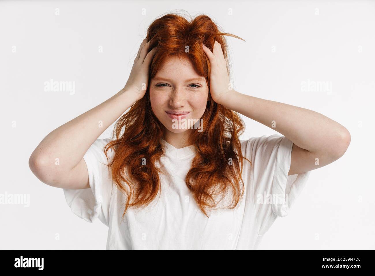 Ginger Beautiful Happy Girl Smiling And Making Fun With Her Hair