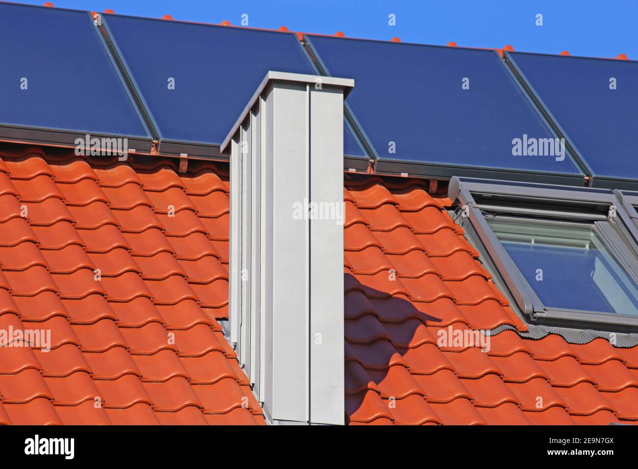 Chimney with stainless steel cladding on a newly covered roof Stock ...