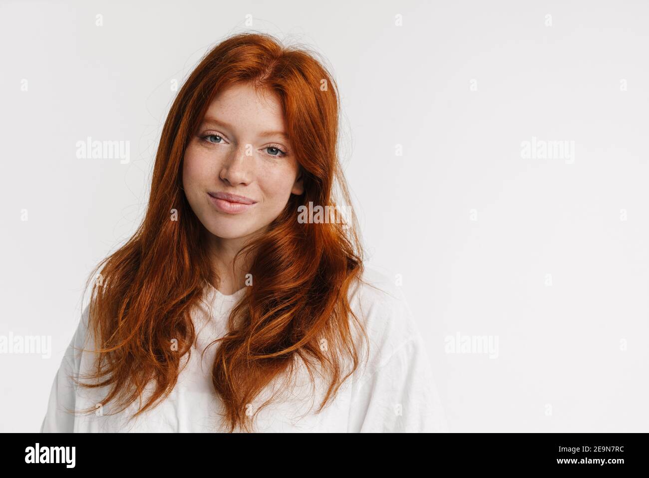 Ginger beautiful happy girl posing and smiling at camera isolated over ...