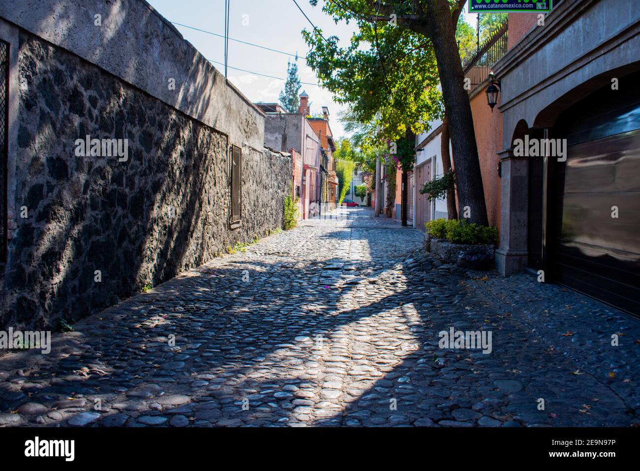 Colorful Hispanic houses in empty alley from Mexico City Stock Photo ...