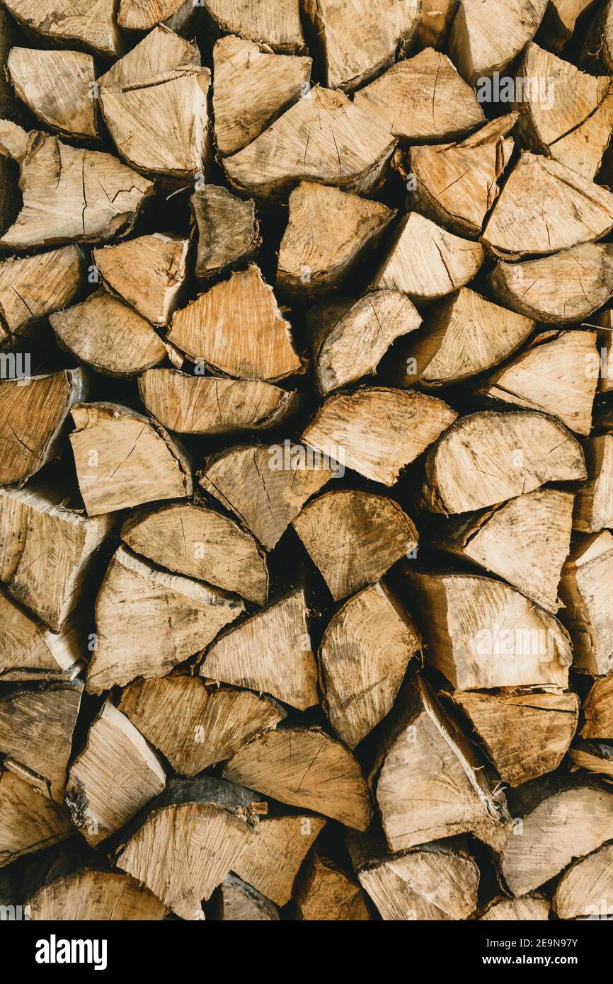 Lots of firewood or wood logs rustic background texture Stock Photo - Alamy