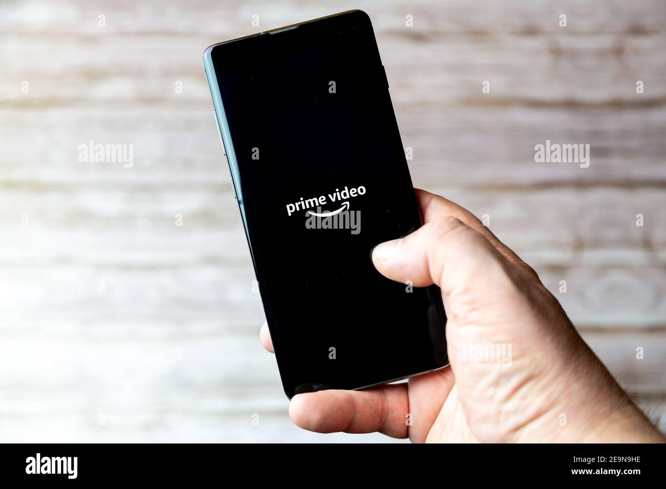 A Mobile phone or cell phone being held showing the Amazon Prime video ...