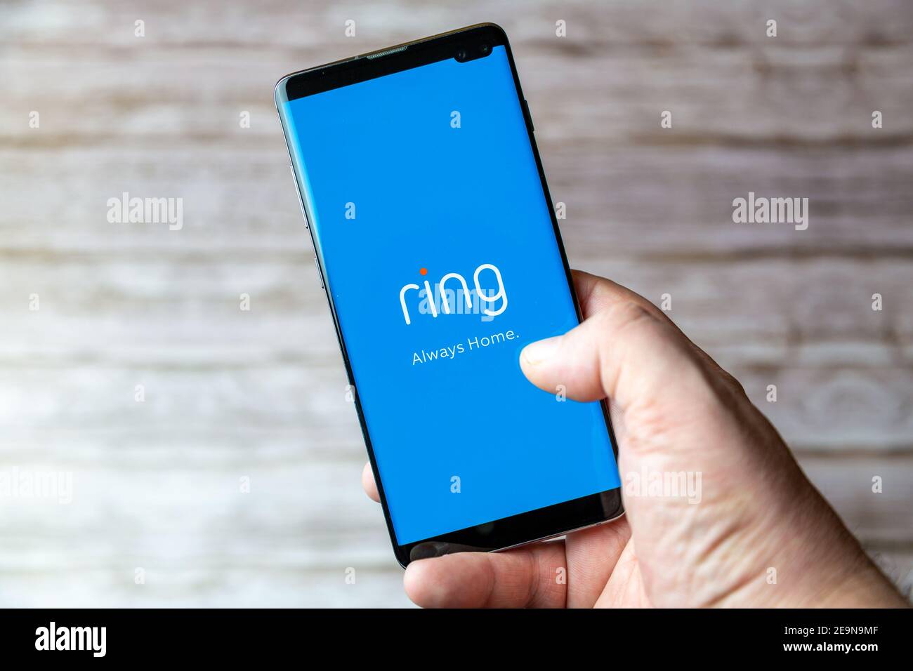 A Mobile phone or cell phone being held showing the Ring doorbell app ...