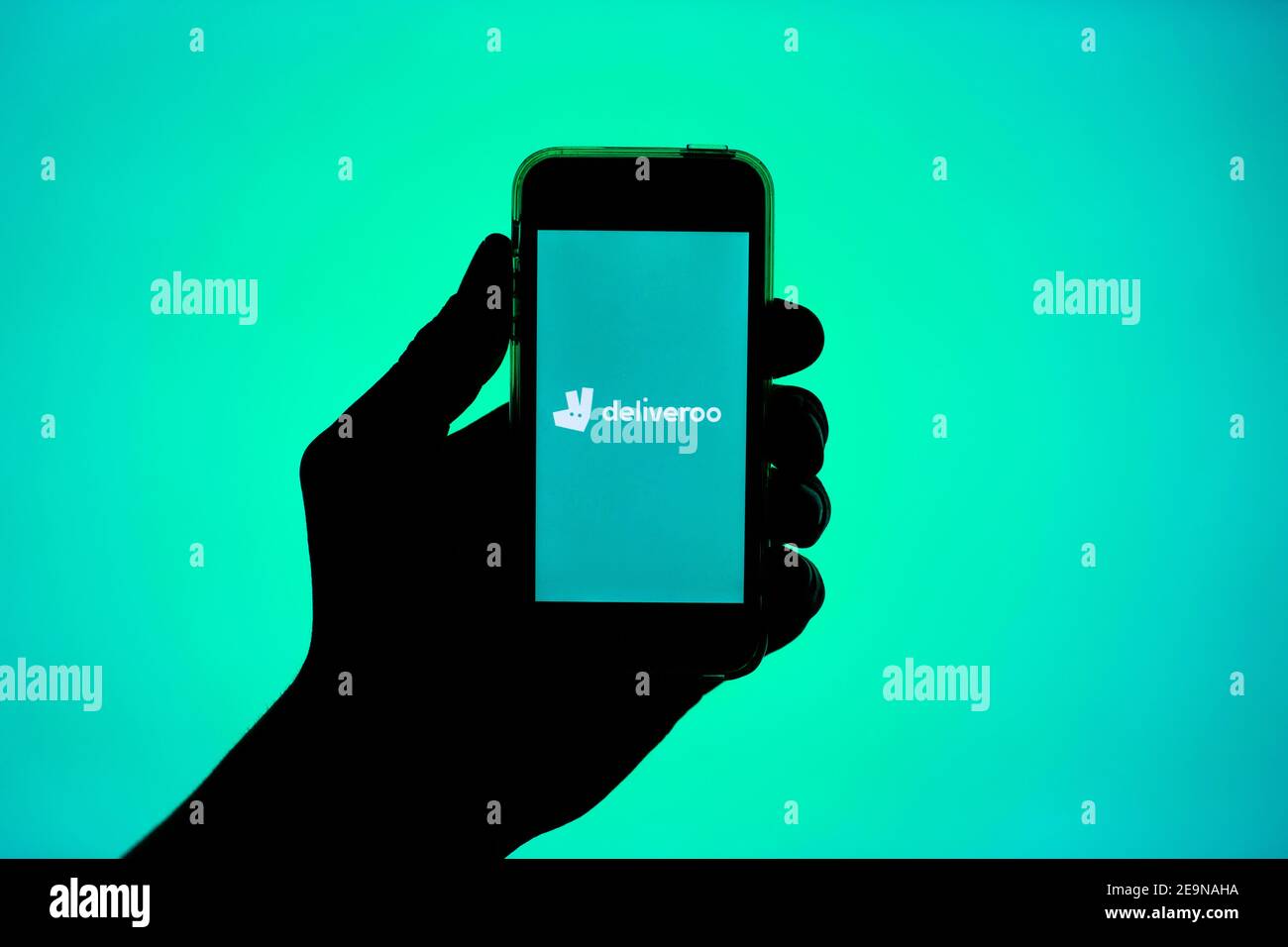In this photo illustration the Deliveroo logo seen displayed on a ...