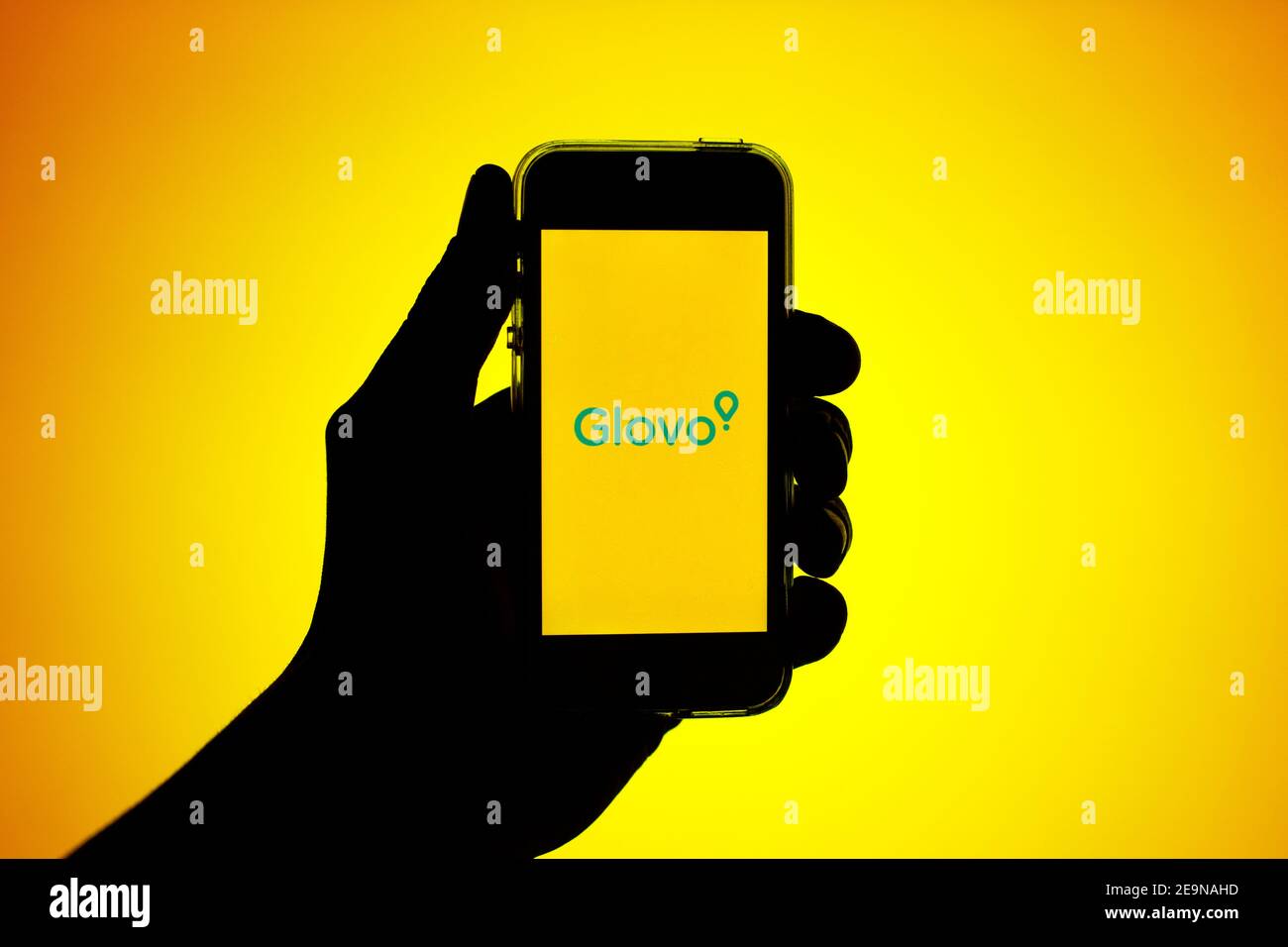 In this photo illustration the Glovo logo seen displayed on a ...
